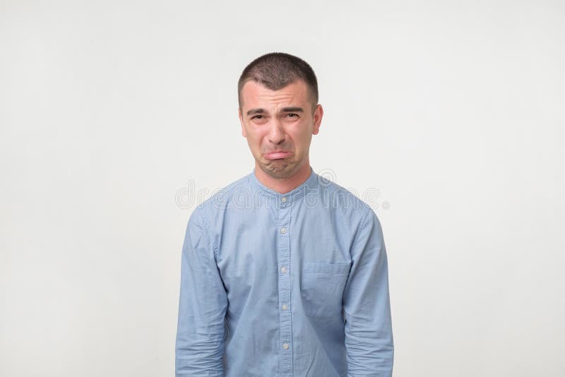 Studio Shot of Young Handsome Man, Pouting and Crying, Complaining ...