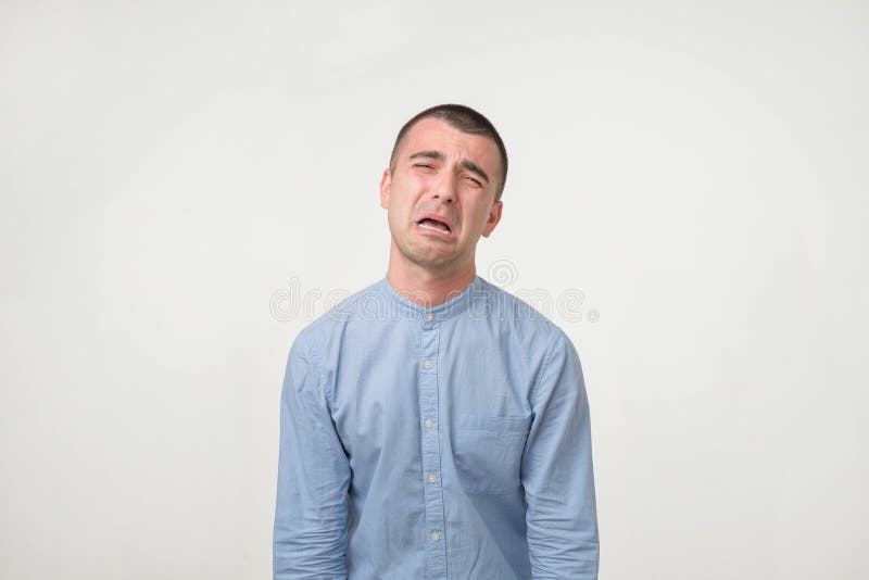 Studio Shot of Young Handsome Man, Pouting and Crying, Complaining ...