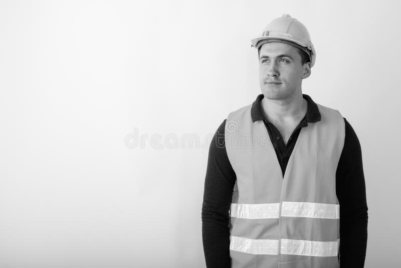 Studio Shot of Young Muscular Man Construction Worker Thinking while ...