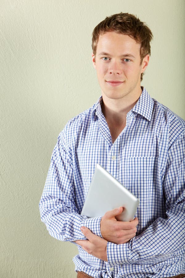 Studio Shot of Young Man Holding Tablet Computer Stock Image - Image of ...