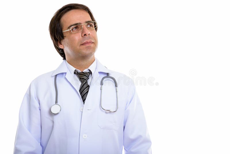 Studio Shot of Young Persian Man Doctor Thinking Stock Photo - Image of ...