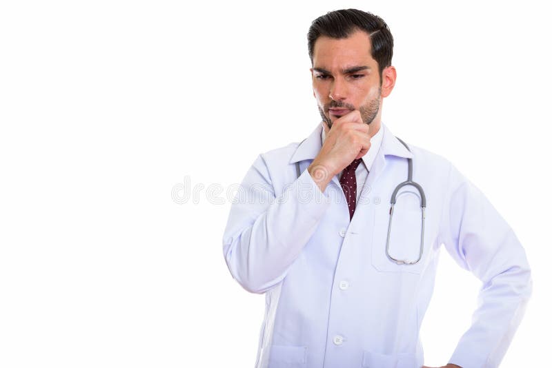 Studio Shot of Young Serious Man Doctor Thinking while Looking D Stock ...