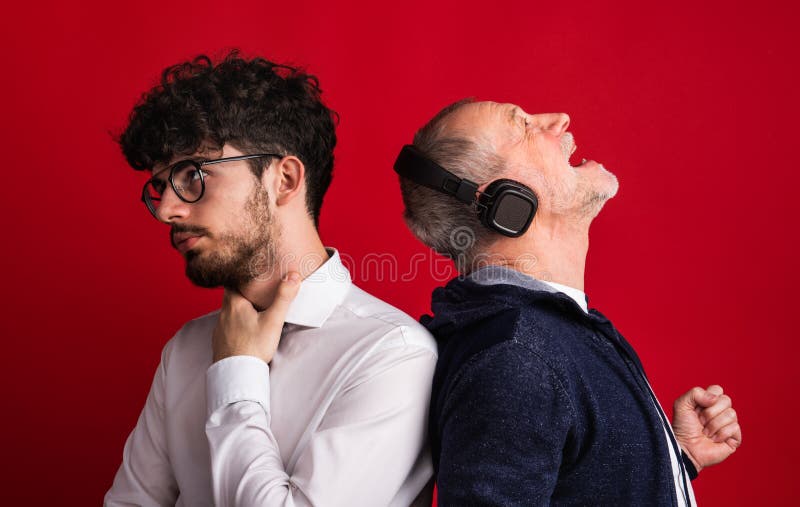 Studio Shot of Young Versus Old Generation, Technology Addiction ...