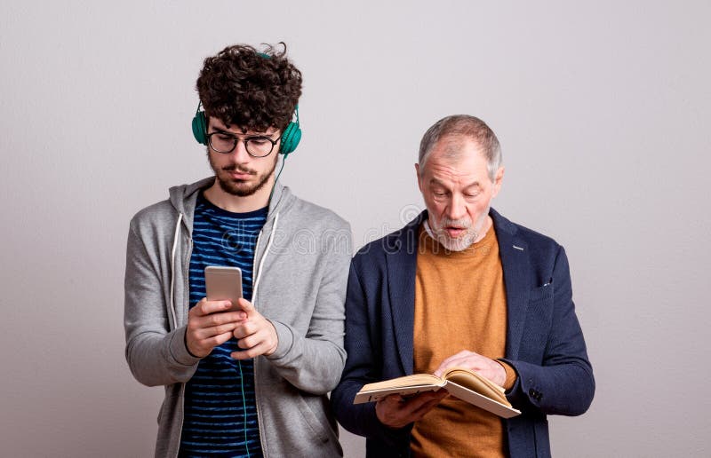 Studio Shot of Young Versus Old Generation, Technology Addiction ...