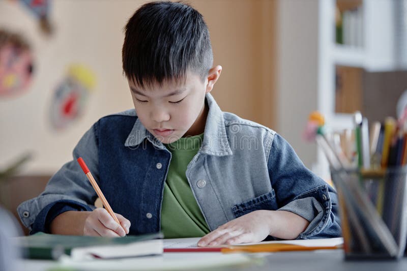 Studious Primary School Student Learning in Lesson Stock Photo - Image ...