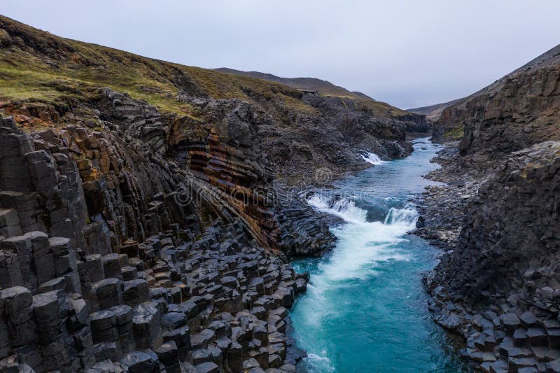 Studlagil Canyon with Basalt Columns and Blue Water Stream Stock Image ... Studlagil Canyon with Basalt Columns and Blue Water Stream Stock Image ...