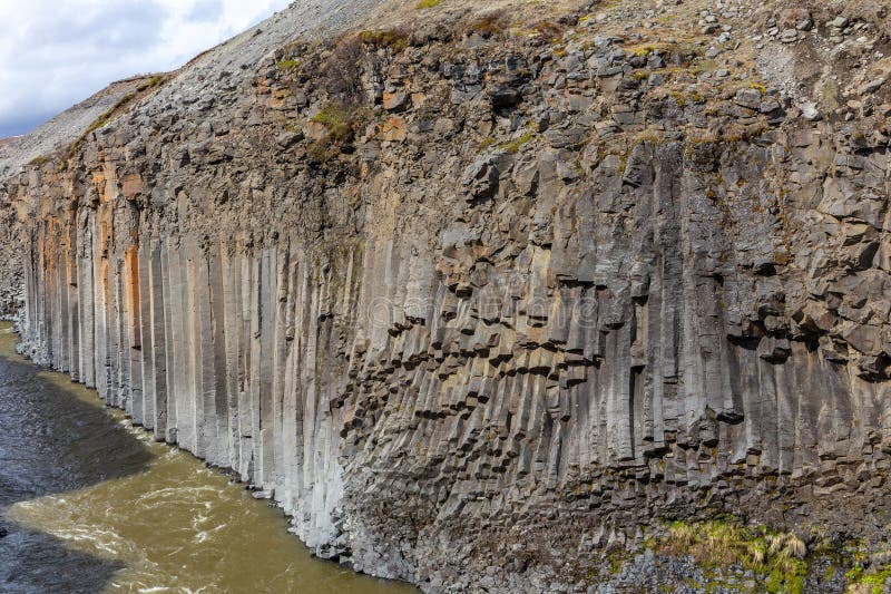 Studlagil Canyon (the Basalt Canyon) with Brown Glacial River and ...
