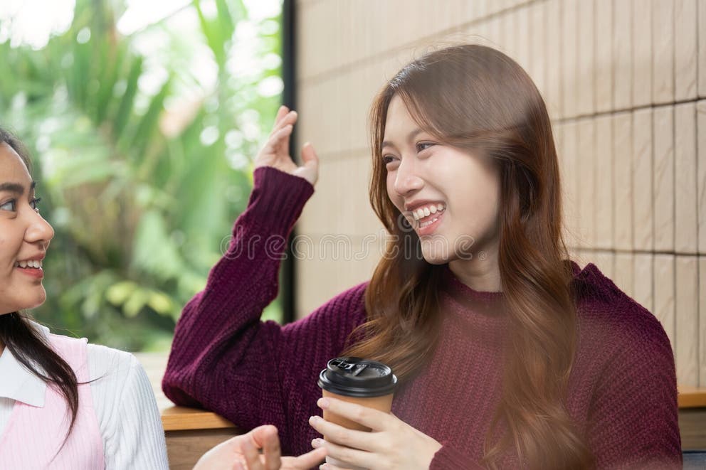 Study Group and Collaboration. Students Sharing Ideas while Enjoying Their Coffee in a Cozy Cafe ...