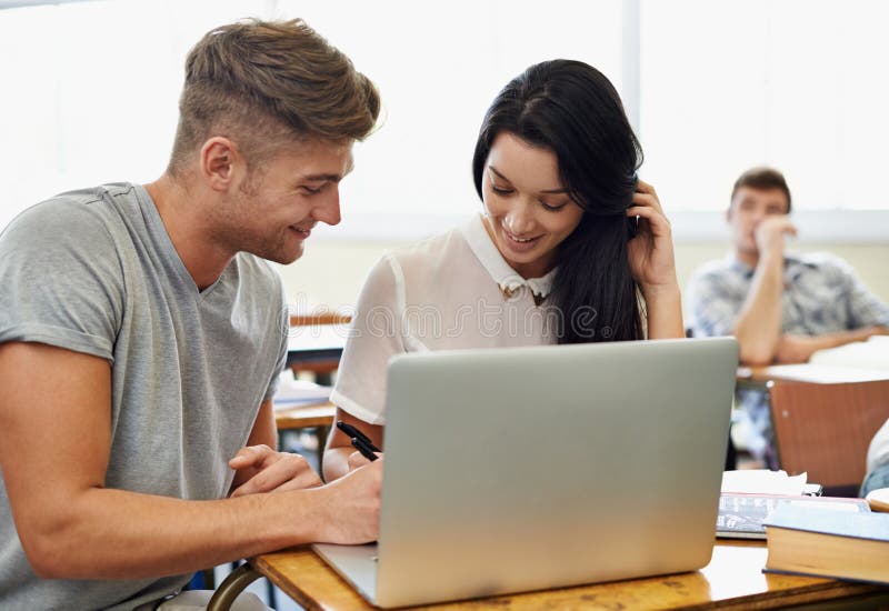 Study Partners. a Young Male and Female Student Studying in a Classroom ...