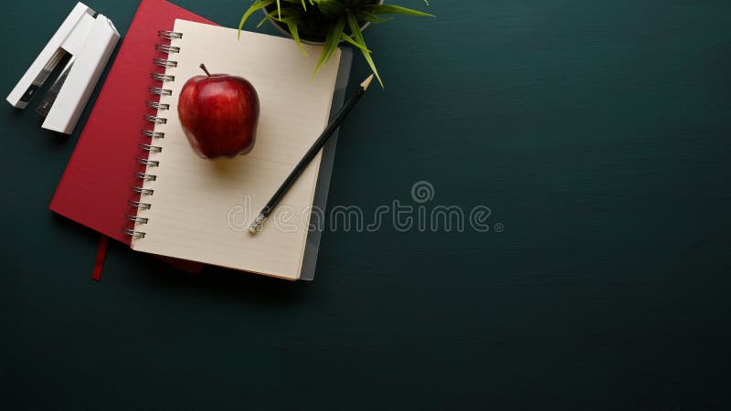 Study Table with Notebook, Book, Pencil, Apple and Copy Space on Dark ...
