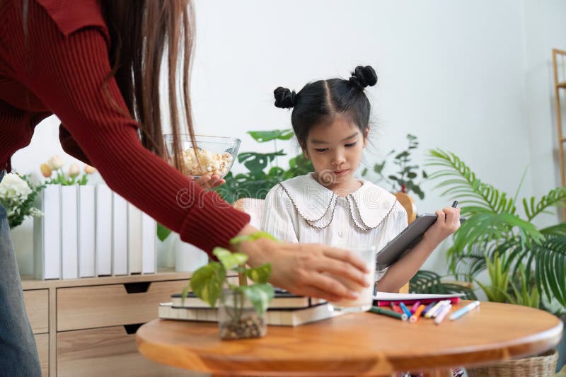 Study Time and Parental Support. a Mother Engages Her Child in a ...