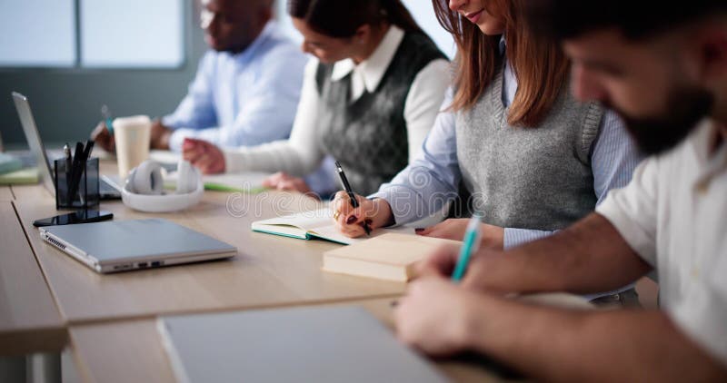 Studying in Classroom at Campus. Students Writing Stock Photo - Image ...