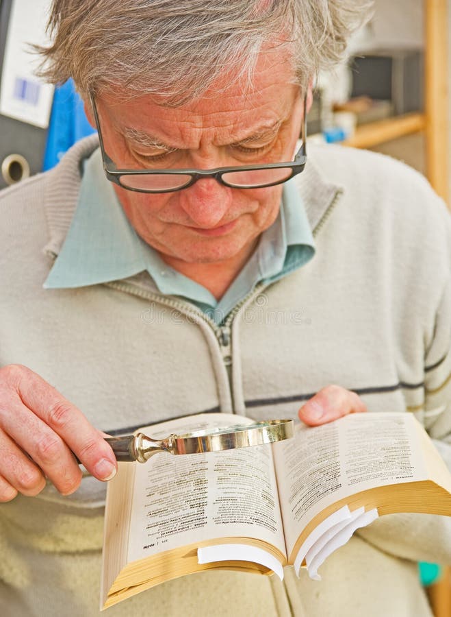 Studying a dictionary. stock image. Image of glasses - 16926505