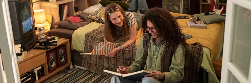 Studying and Discussing Notes in Cozy Bedroom Setting Stock Image ...