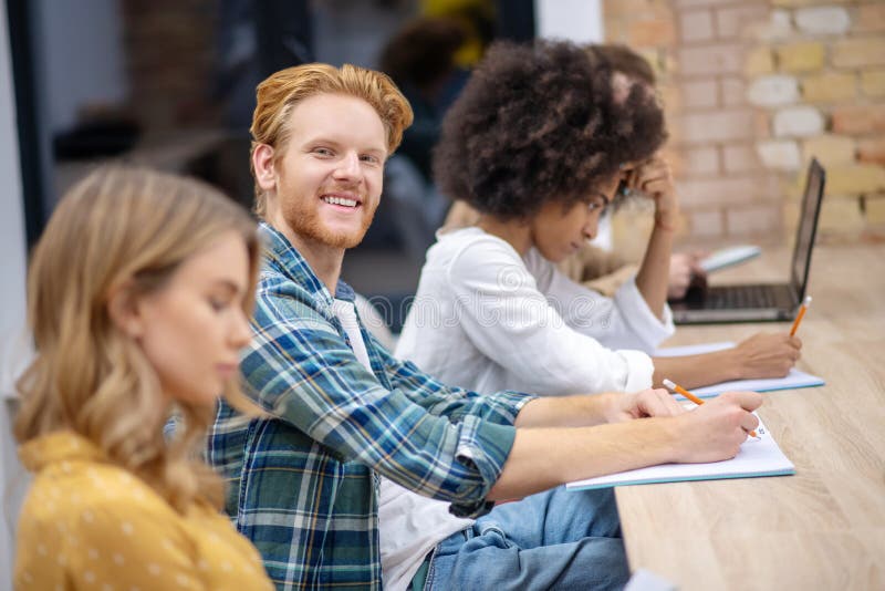Group of Students Having a Class and Looking Contented Stock Photo ...