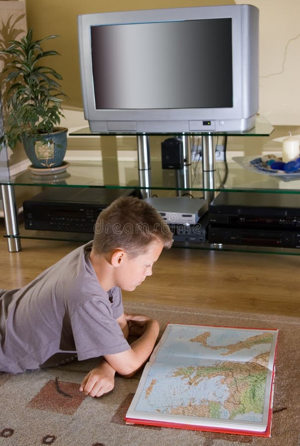 Boy studying a map stock photo. Image of education, keen - 12861860