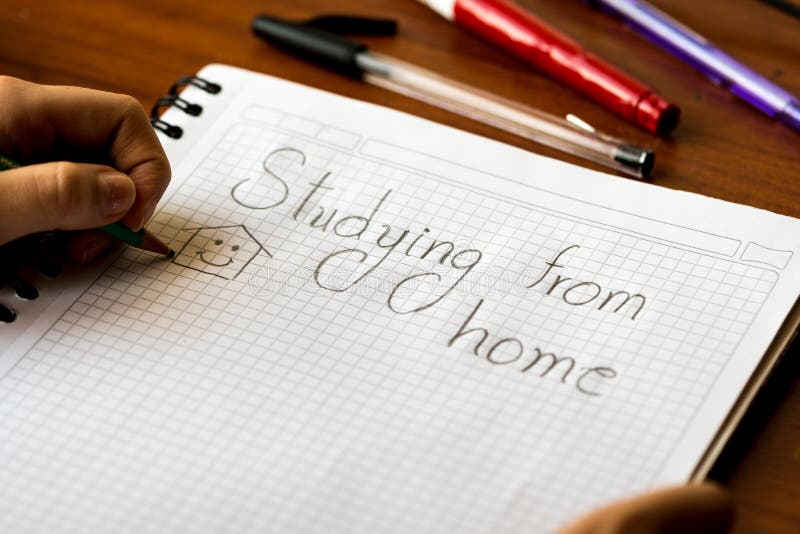 `Studying from Home` Phrase Being Written on a Notebook with a Pencil ...