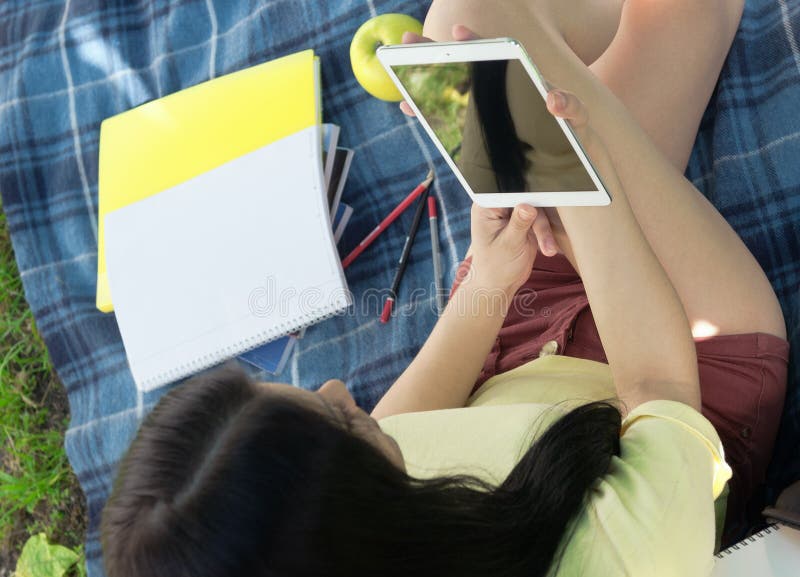 Studying with ipad on park stock image. Image of ipad - 50785539