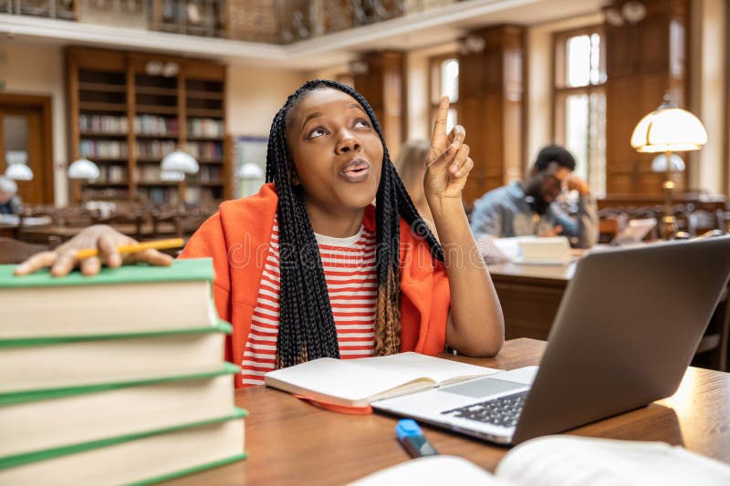 Long-haired Young Woman Studying in the Library Stock Photo - Image of ...