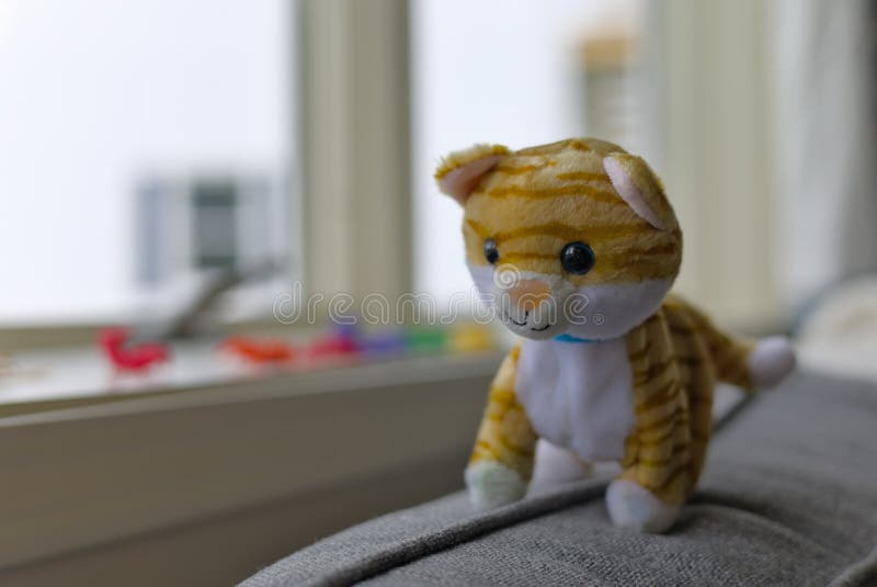 A Stuffed Animal Sitting on a Couch Stock Image - Image of furniture ...