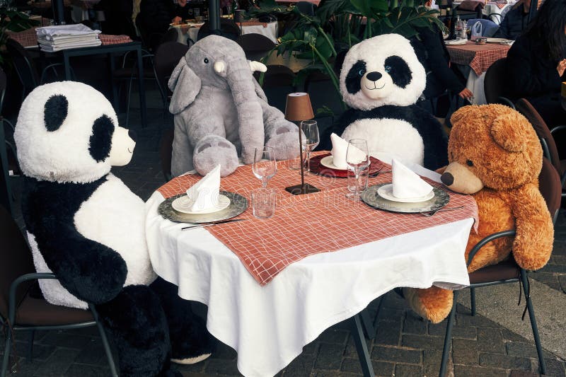 Stuffed Animals Sitting at a Table, Having a Lunch Party Stock Image ...