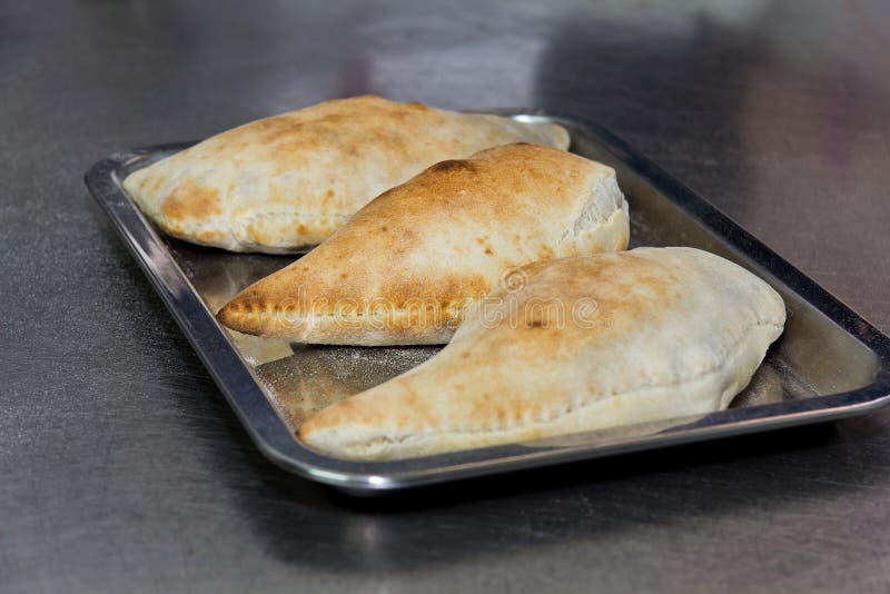 Stuffed calzone stock photo. Image of chef, eating, calzones - 39150292