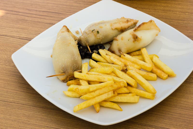 Stuffed Cuttlefish and Chips Stock Image - Image of scene, baby: 40648957