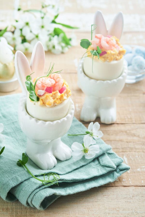Stuffed or Deviled Eggs Yolk, Shrimp, Pea Microgreens with Paprika for Easter Table Decorate ...
