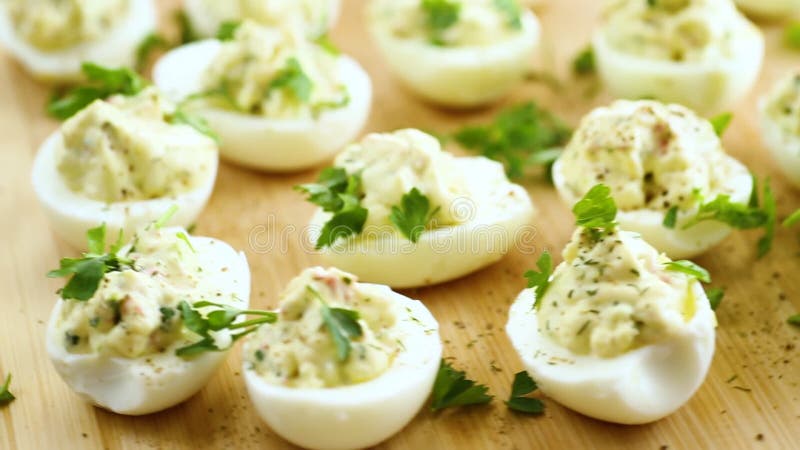 Stuffed Eggs, Deviled Eggs on a Wooden Table Stock Video - Video of ...