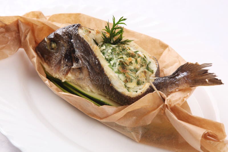 Stuffed fish in paper stock image. Image of grilled, butter - 72363635