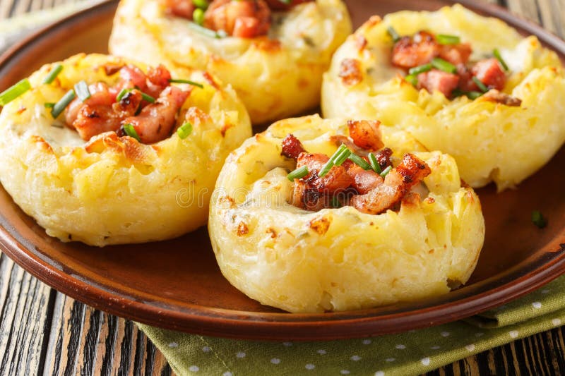 Stuffed Mashed Potato Nests Filled with Bacon and Onion Close-up in a ...