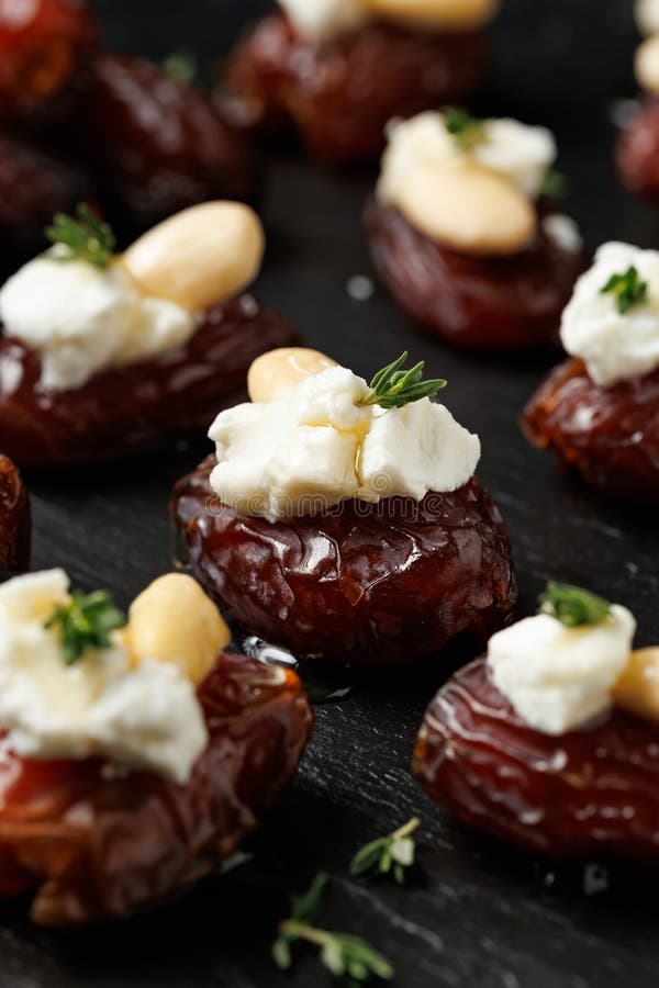 Stuffed Medjool Dates with Goat Cheese, Almonds and Honey Stock Photo ...