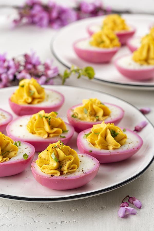 Stuffed Pink Boiled Deviled Eggs with Pepper and Mayonnaise Stock Photo ...