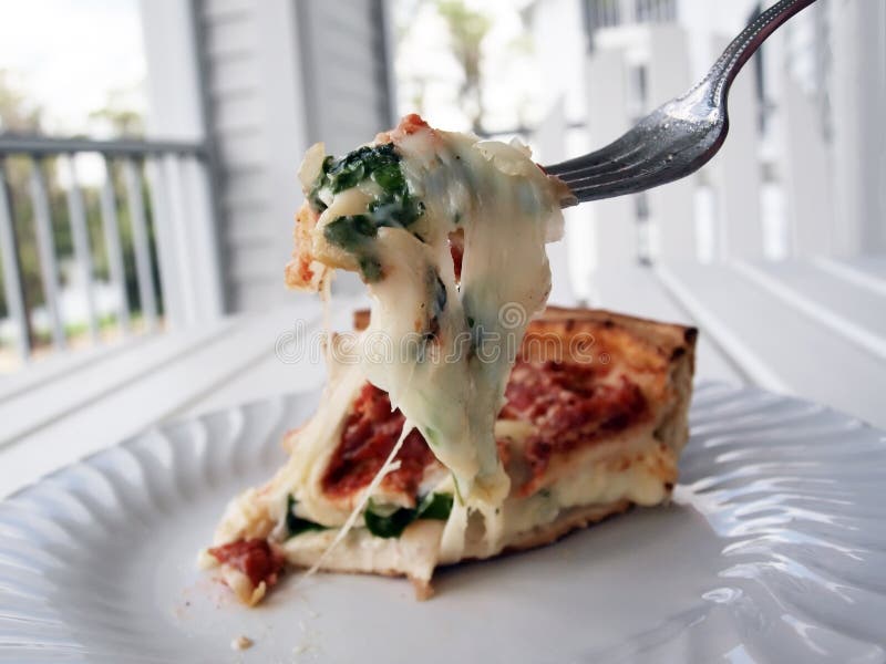 Stuffed pizza & fork 3 stock image. Image of style - 10506611