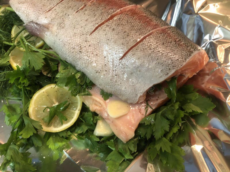 Stuffed Red Fish Trout or Salmon with Lemon on Foil Stock Photo - Image ...