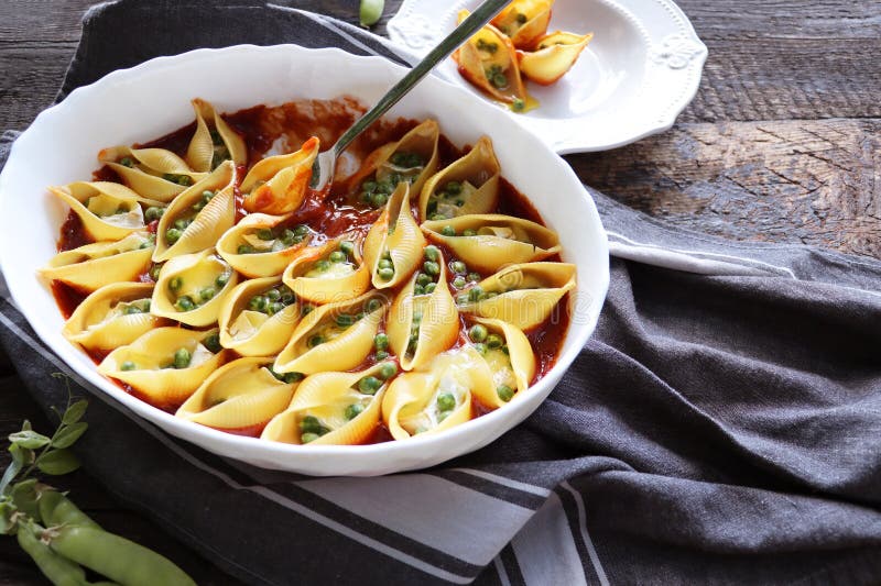 Stuffed Shells with Peas and Cheese in Tomato Sauce Stock Photo - Image ...