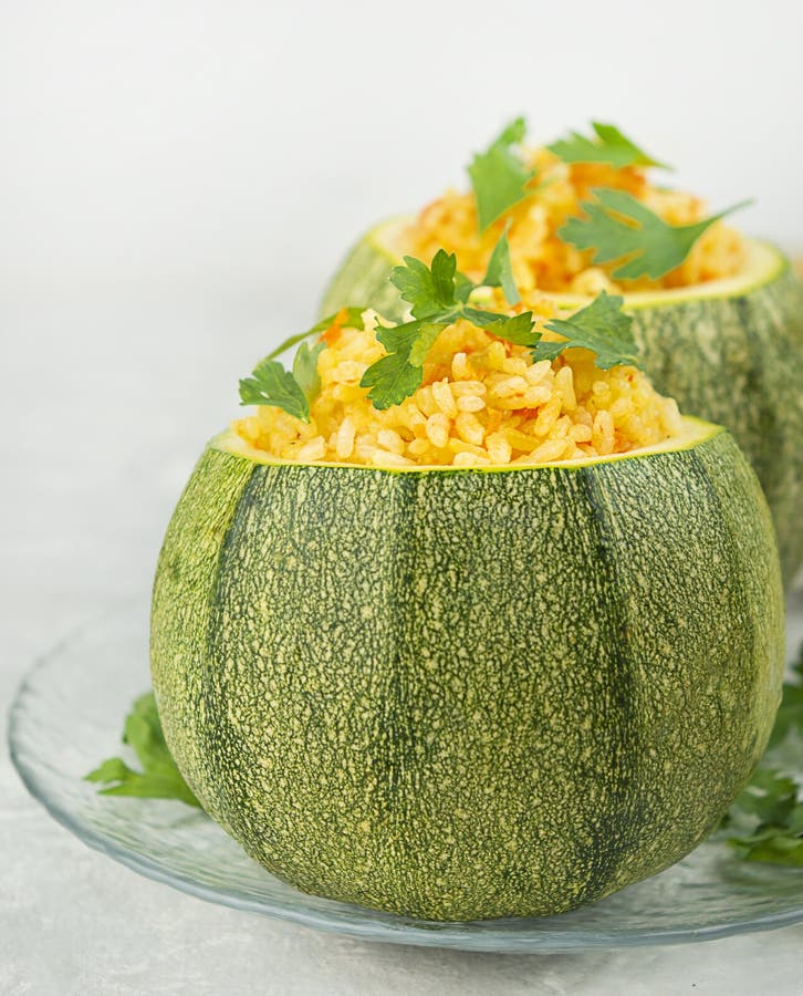 Stuffed Zucchini with Rice and Vegetables on a Light Table. Side View ...