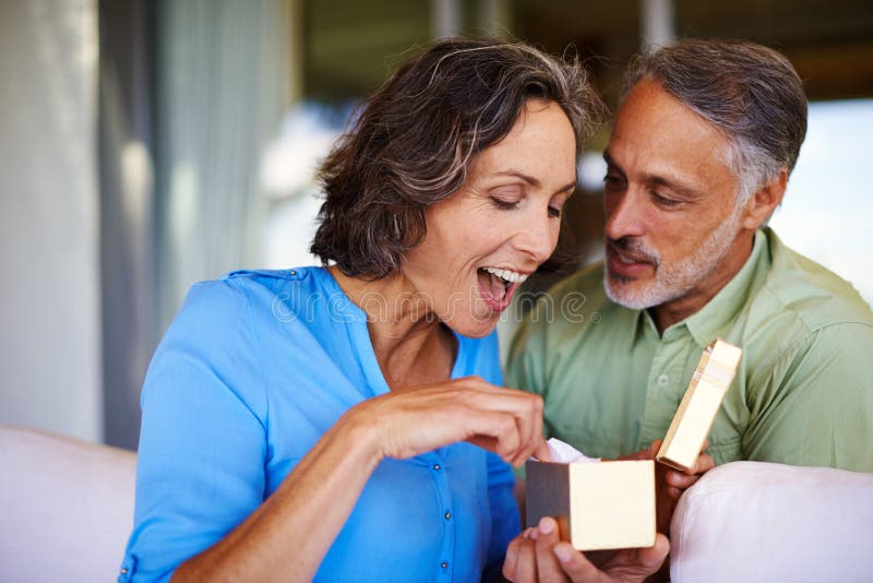 Stunned by the Beauty of the Gift. a Woman Opening a Gift. Stock Photo ...