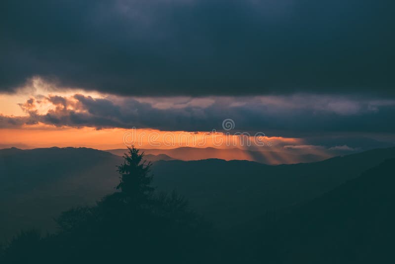 Stunning Alpine Landscape with Golden Skies and Dramatic Clouds Stock ...