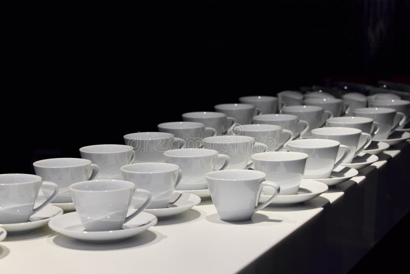 An Elegant Display of White Tea Cups Beautifully Arranged on a Chic and ...