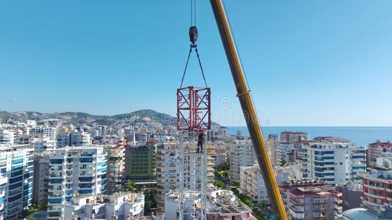 Aerial View: Operator Works High Above, Mounting Crane Components and ...