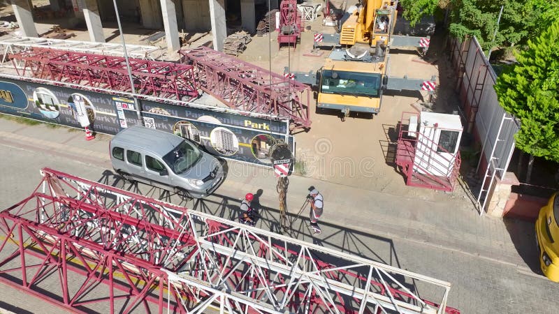 Aerial View: Crane Installation Progresses Smoothly with Engineers ...