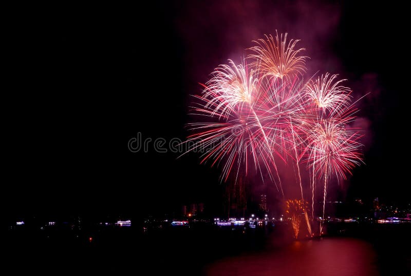 Stunning Red Fireworks Balls Exploding on the Sky at Night Stock Photo ...