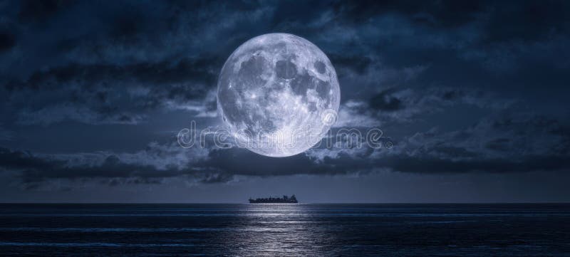 The Stunning Full Moon Illuminating a Tranquil Ocean with a Distant ...