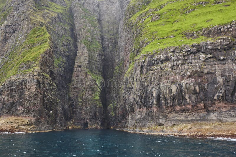 Stunning Green Cliffs and Caves. Atlantic Ocean, Faroe Islands Stock ...