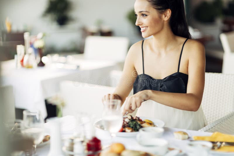 Stunning lady having lunch stock photo. Image of food - 60701580