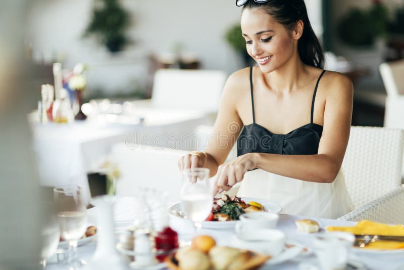 Stunning lady having lunch stock image. Image of lady - 64783141