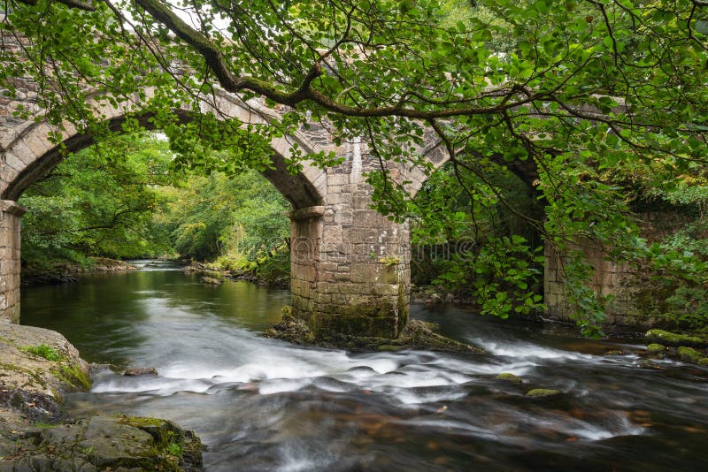 Stunning Landscape Image of Old Stone Bridge Over Flowing River Stock ...