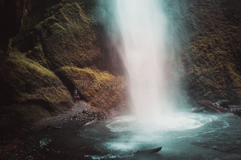 Stunning Landscape of a Powerful Waterfall Cascading Over Rocky Terrain ...