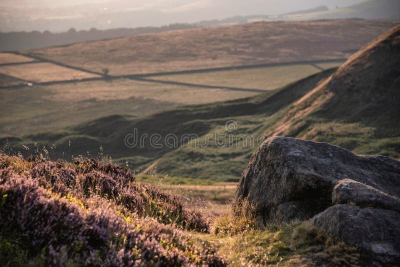 Stunning Late Summer Landscape Image Looking through Rocks and Heather ...